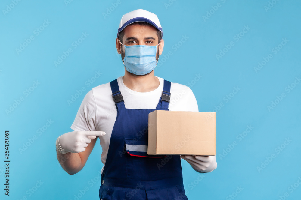 Cargo transportation, delivery service. Friendly worker in uniform and ...