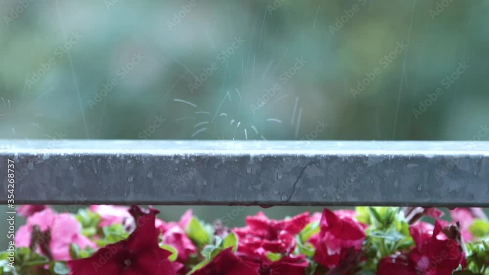 Vídeo do Stock: Drops of rain fall on the railing of the balcony of the ...