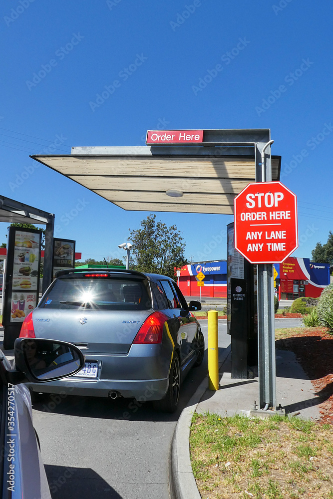 Melbourne, Australia: March 19, 2017: Cars wait in line at a McDonald's ...
