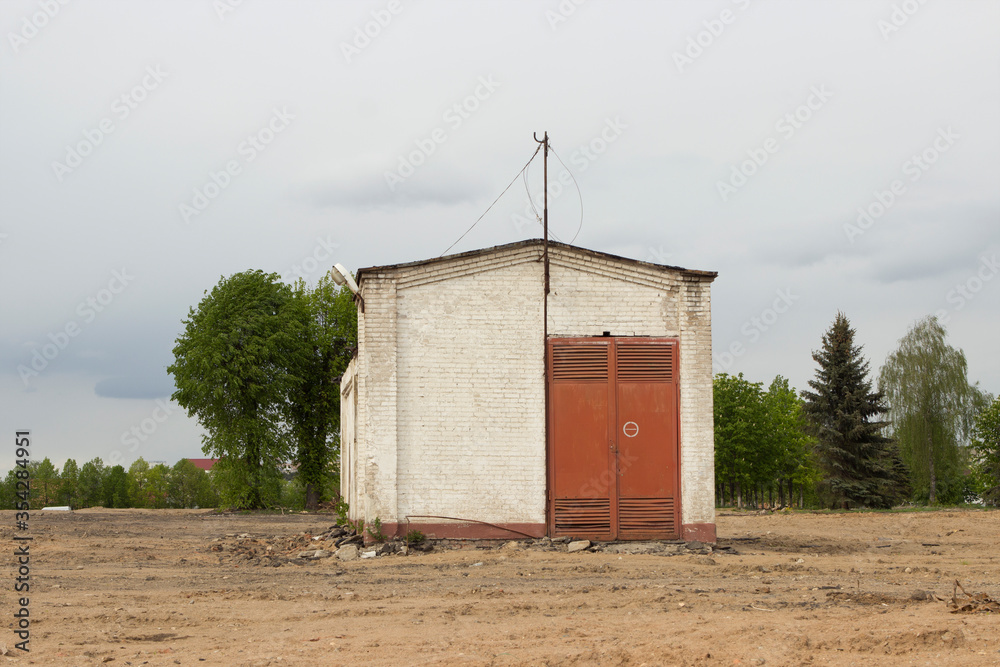 Old abandoned Electrical Substation untanking tower in a wasteland ...