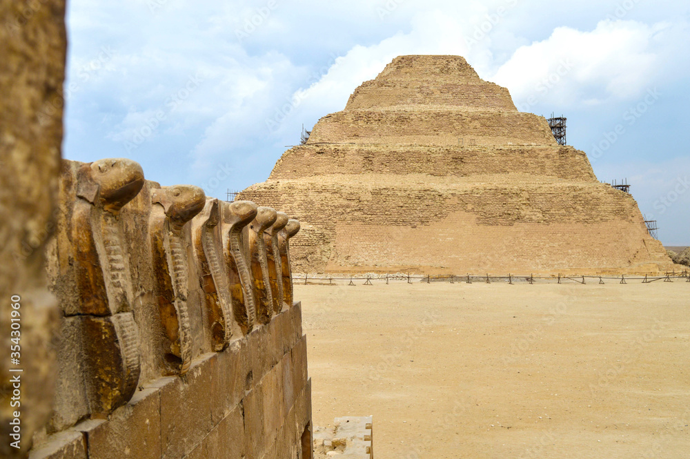 Ancient Egyptian step pyramid of Djoser in Saqqara on a cloudy day ...