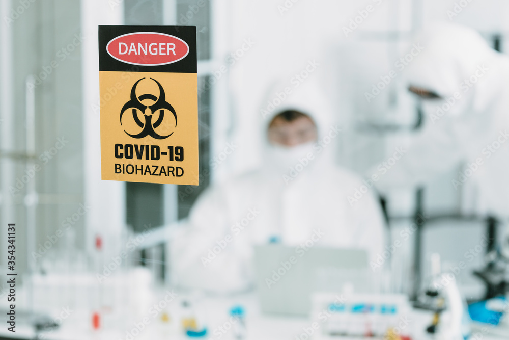 Lab Technician in Personal protective equipment PPE suit Vaccines ...