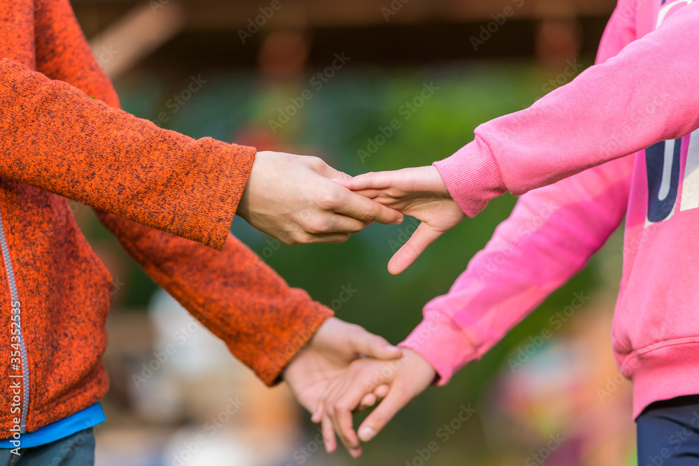 Children hold hands. Boy and Girl hold each other's hands. Children's ...