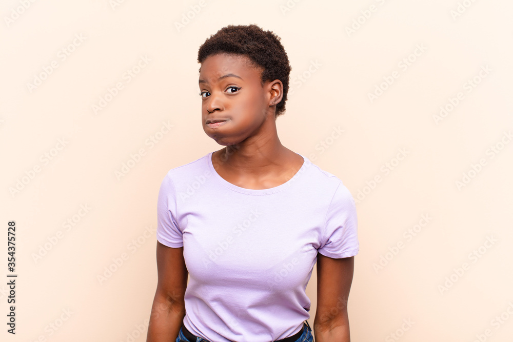 young pretty black womanwith a goofy, crazy, surprised expression ...