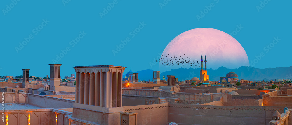 Poster Silhouette of birds flying - Historic City of Yazd with famous ...