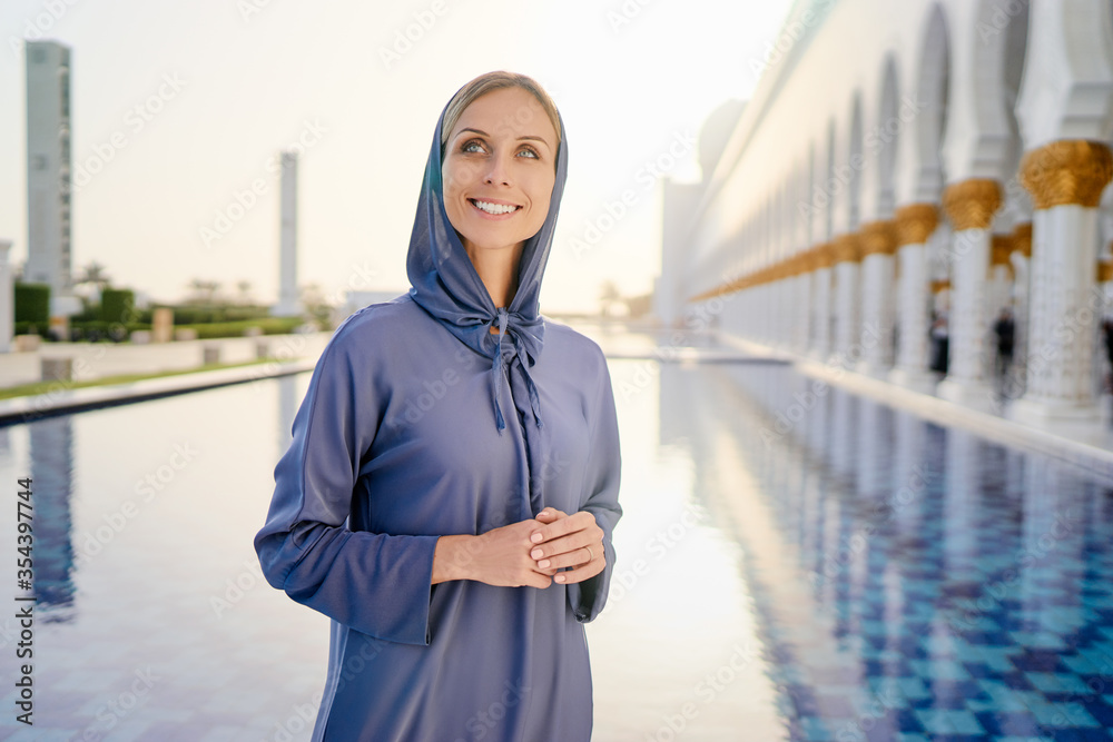 Traveling by Unated Arabic Emirates. Woman in traditional abaya ...