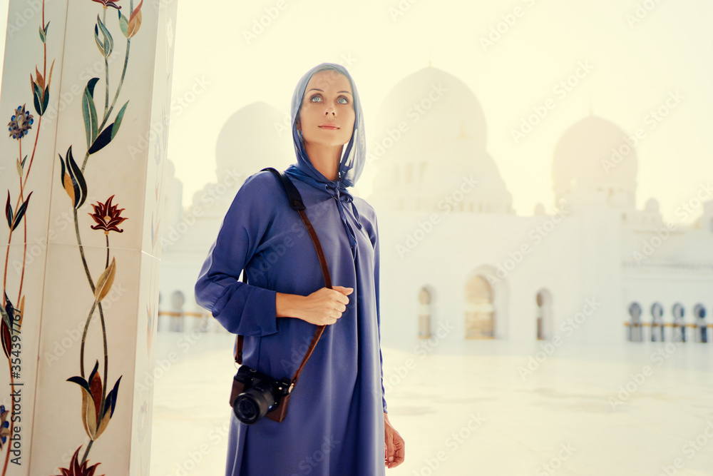 Traveling by Unated Arabic Emirates. Woman in traditional abaya ...