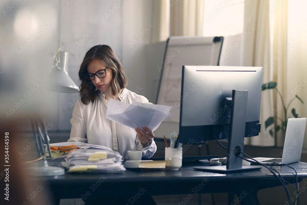 Beautiful business woman sitting concentrated in her work in front of ...
