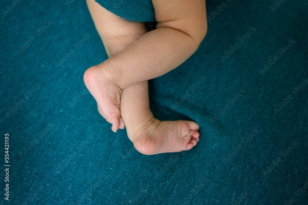 Newborn baby feet, barefoot with tiny toes in selective focus, family ...