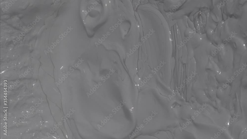 Vertical format footage bubbling volcanic hot mud pot, aggressive ...