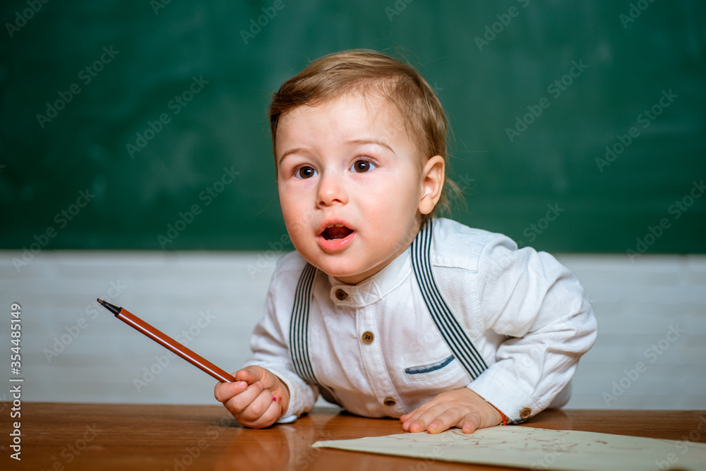 Little preschool at school lesson. Home study. Kid gets ready for ...