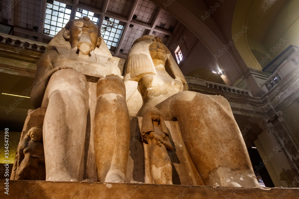 Colossal statues of Amenhotep III and Queen Tiye and their daughter ...