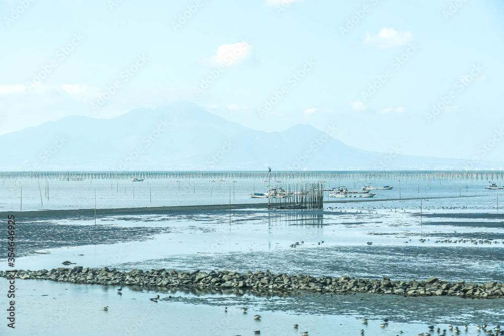 Nature seascape background of sand pattern during low tide under blue ...