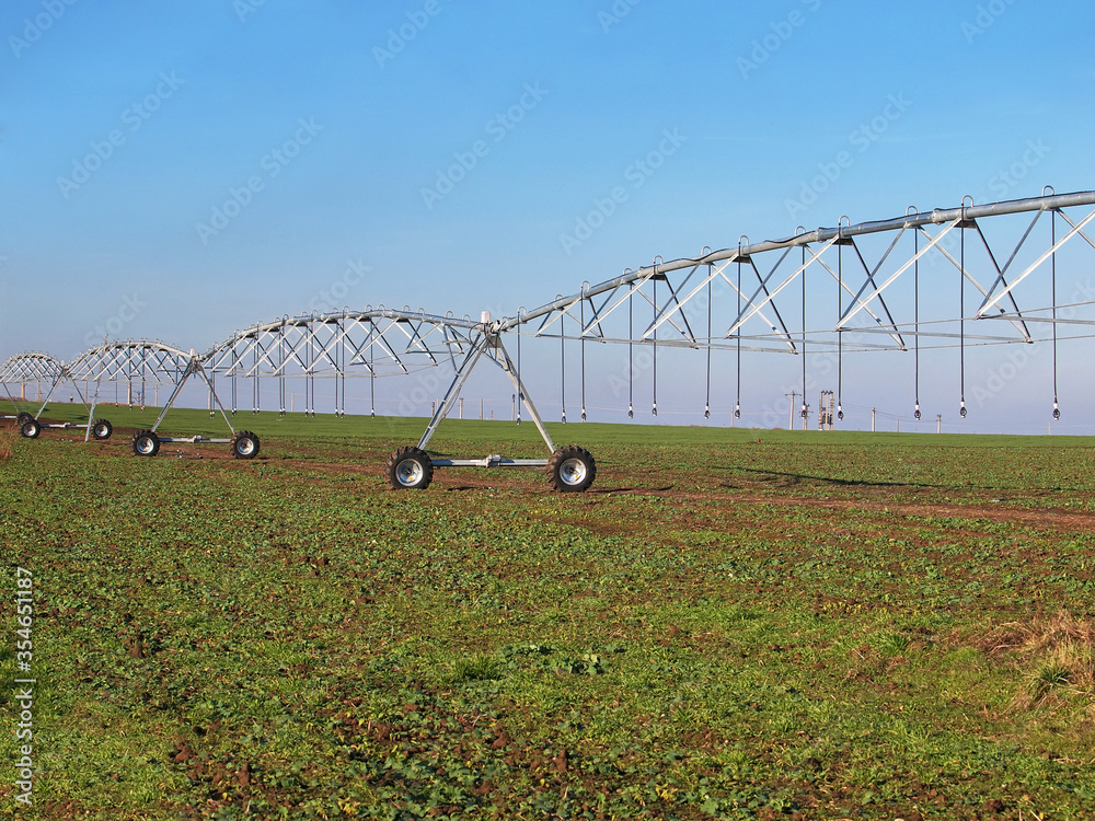 Irrigation system on wheels on the field Stock Photo | Adobe Stock