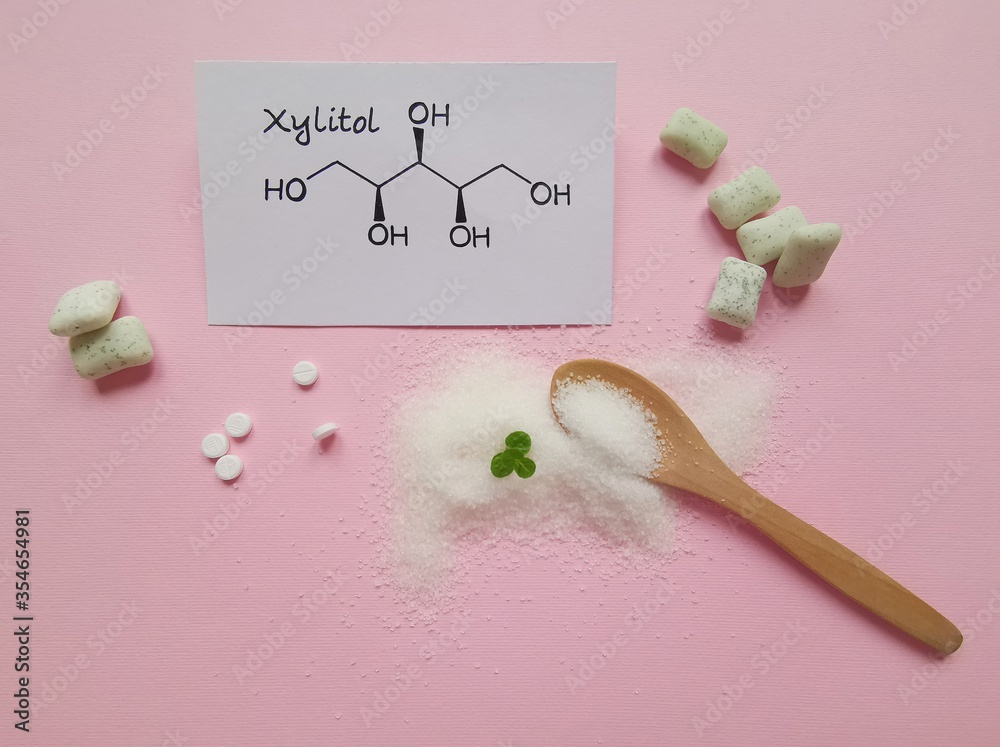 Structural chemical formula of xylitol molecule with chewing gum in the ...