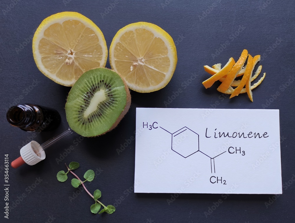 Structural chemical formula of limonene with fresh citrus fruit and a ...