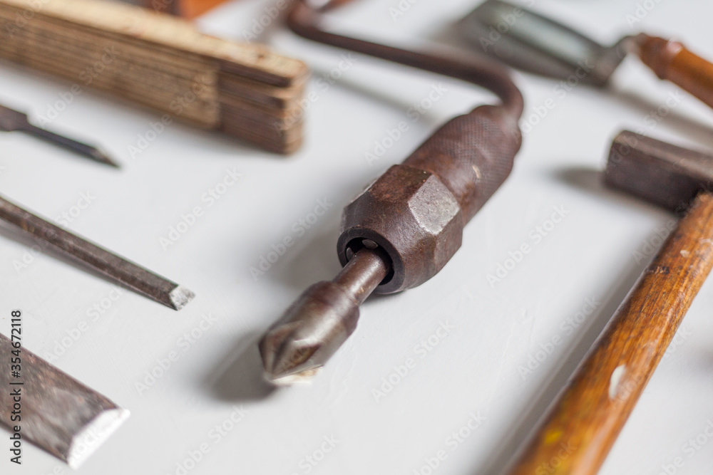 Old hand drill and small wooden hammer with patina attachment Lyre ...