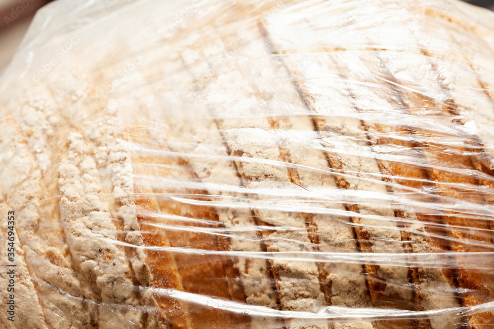 Pre sliced bread with flour in a simple see through transparent plastic ...