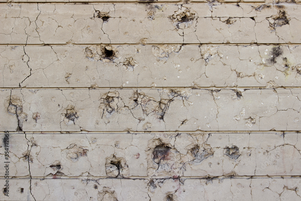 Concrete wall background with bullet holes. Concrete wall background ...