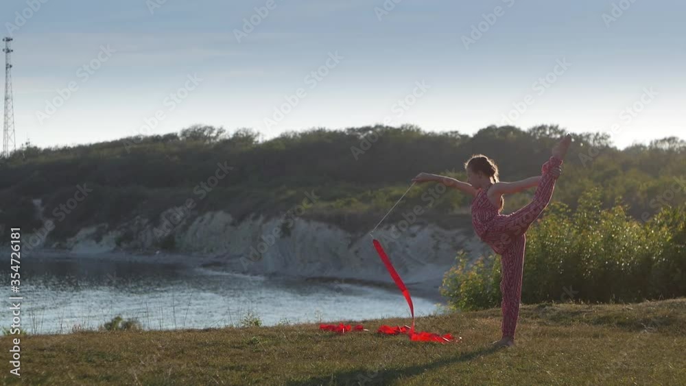 General plan of a teenage girl doing rhythmic gymnastics with a ribbon ...