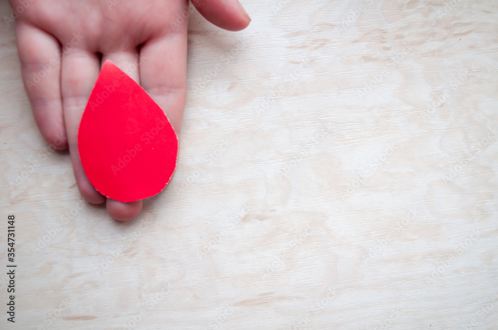 Hand holding blood drop, give blood donation, blood transfusion, world ...