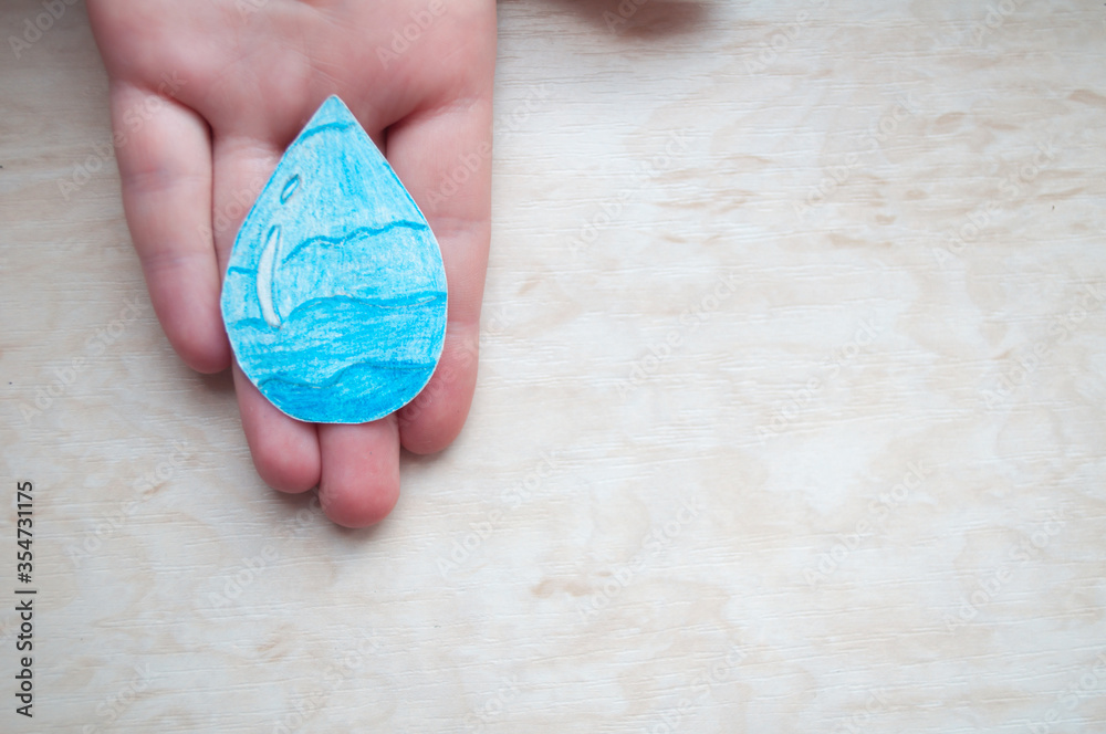 hand holds a drop of water, World Hand Hygiene Day. World Water Day ...