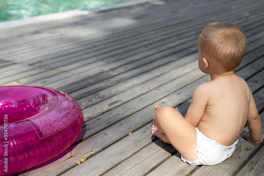 Cute adorable little caucasian blond toddler boy kid in diaper ...