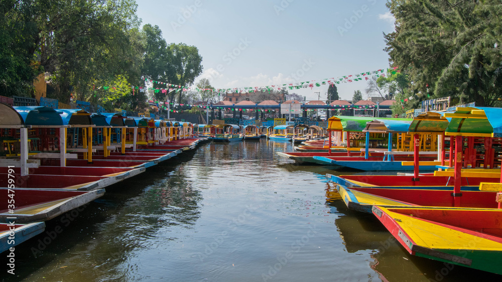 Traditional Mexican trajinera boat in the Xochimilco channels in Mexico ...