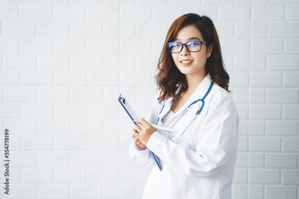 Medical health clinic beautiful Asian doctor working using laptop ...