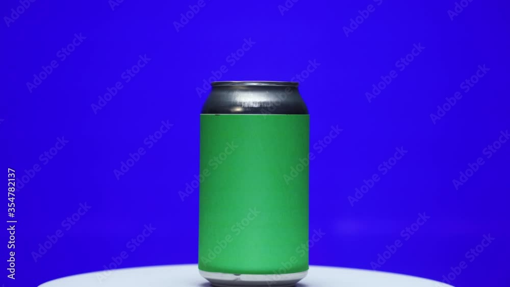 Soda or beer can with chroma green screen label spinning on turntable ...