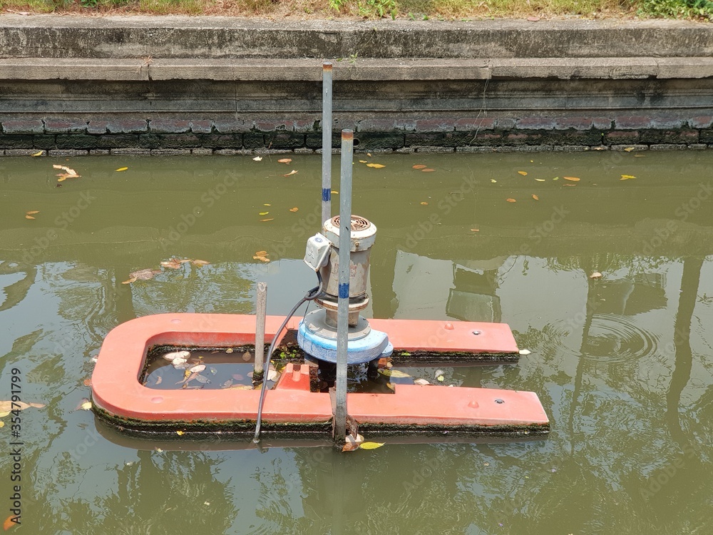 Mechanical compressed air and water suction aerator installed in public ...