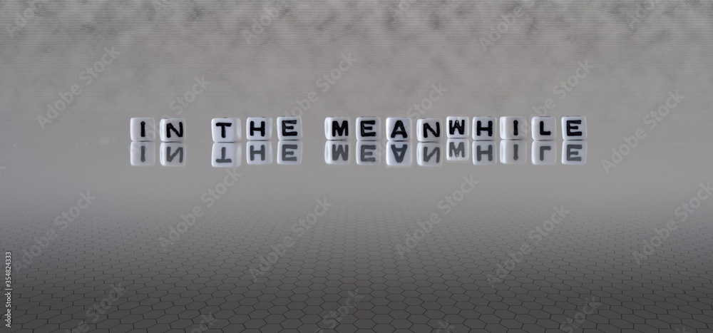 Foto de in the meanwhile concept represented by black and white letter ...