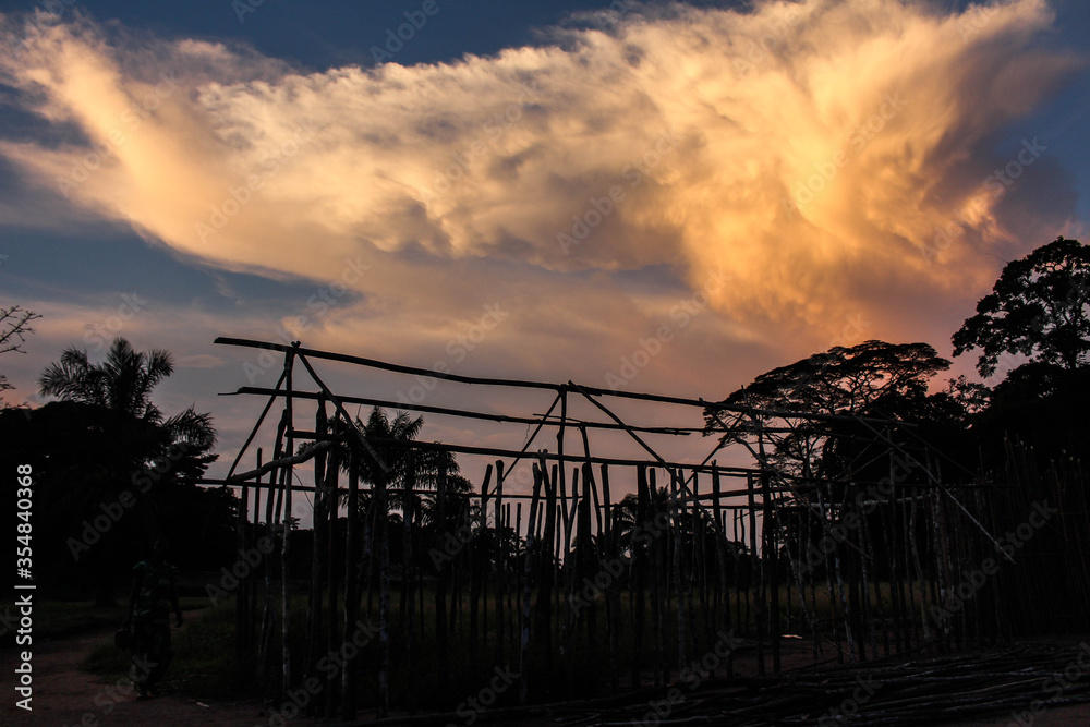 Silhouette of a typical bamboo hut in the Democratic Republic of Congo ...