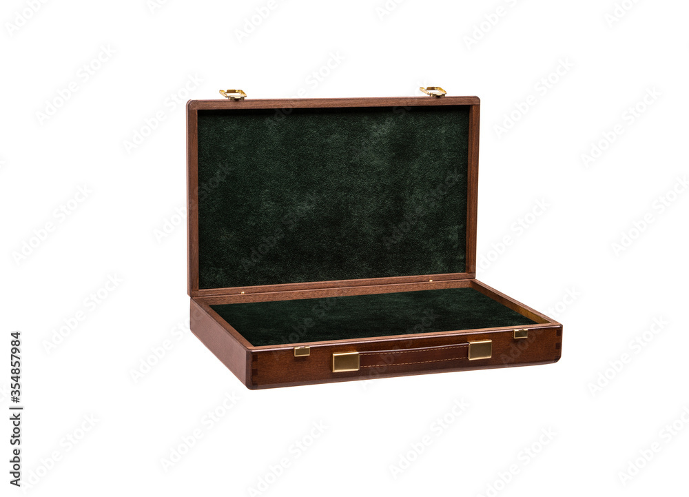 An open box of dark wood with green velvet inside gilded locks isolate ...