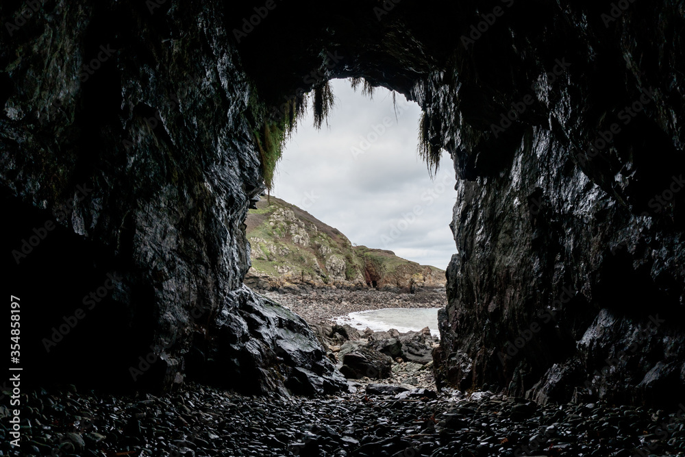 cave in the sea in Sark Stock Photo | Adobe Stock