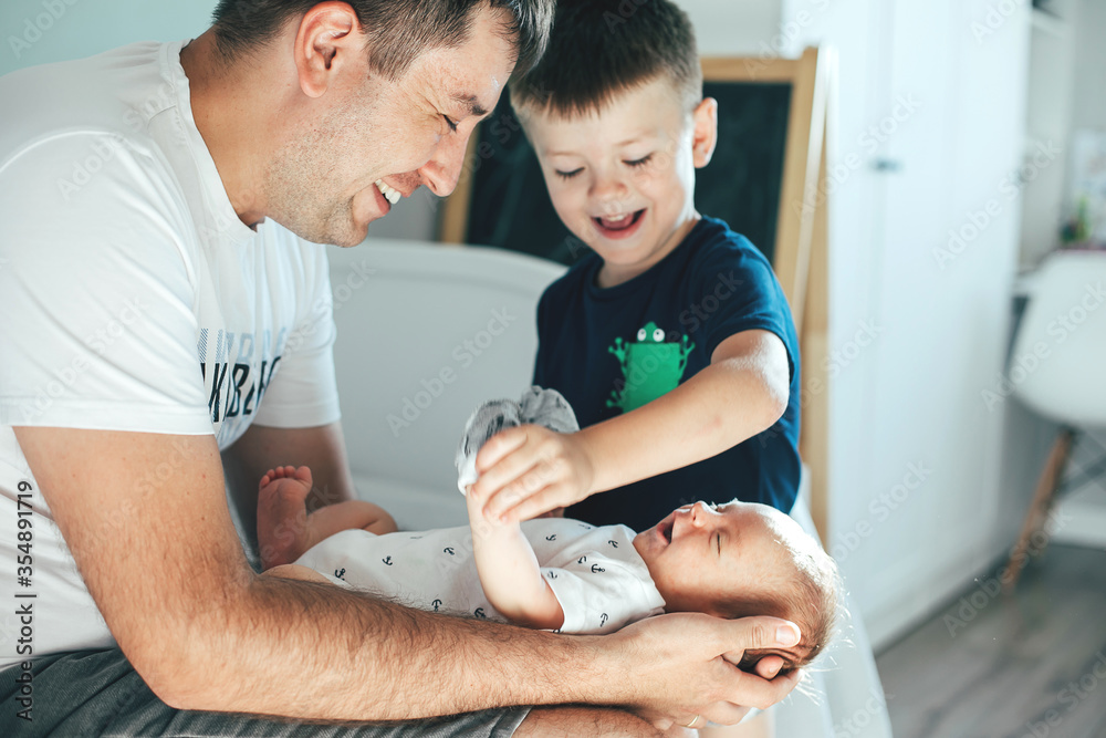 Father's hand hugging cute newborn son. Little baby with father and ...