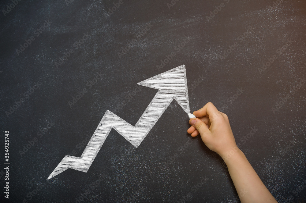 Hand drawing sales chart on blackboard. Report of growing. Stock Photo ...