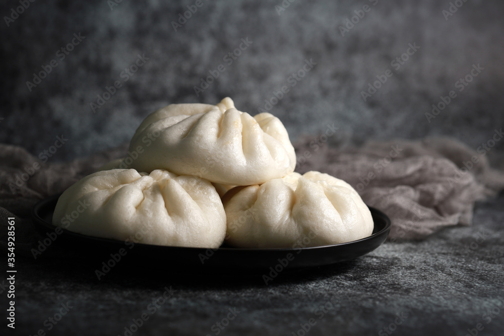 Steamed BBQ pork bun, also know as Baozo, is a type of filled bun or ...