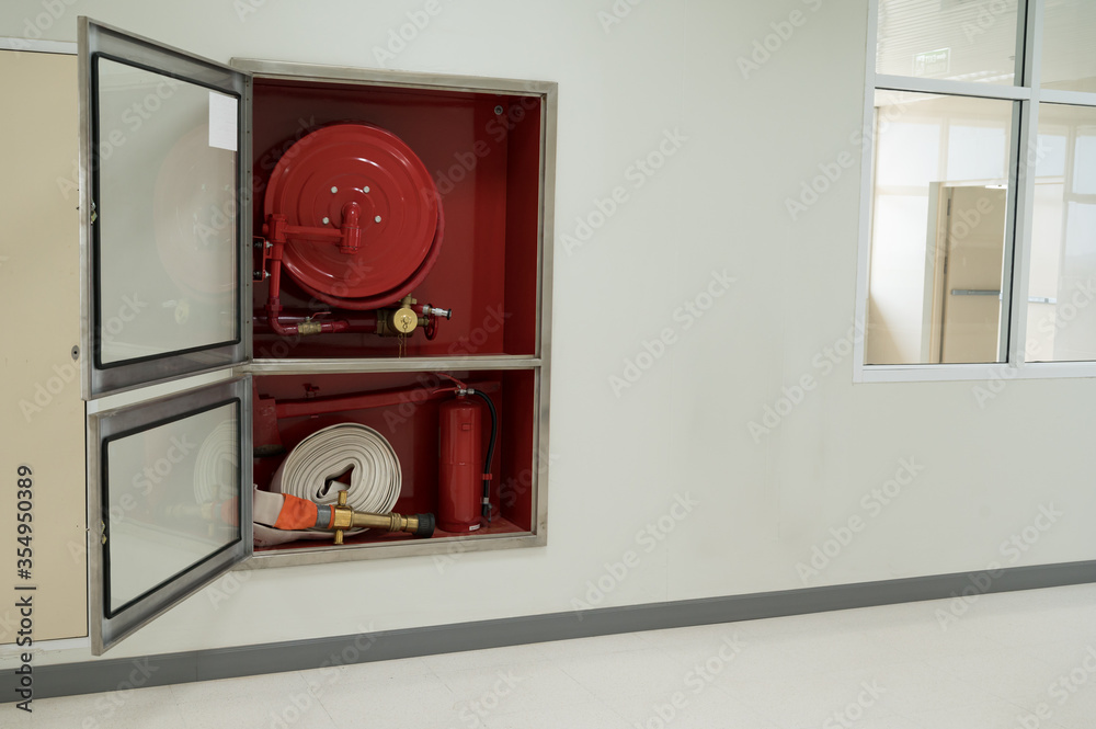 Rescue firefighter equipment, fire line in red box.Fire hose reel in ...