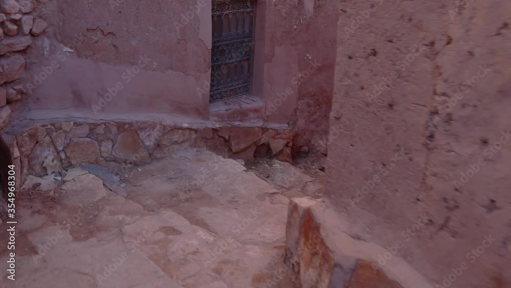 Day POV walk through the narrow streets of oriental city Medina, Ait ...