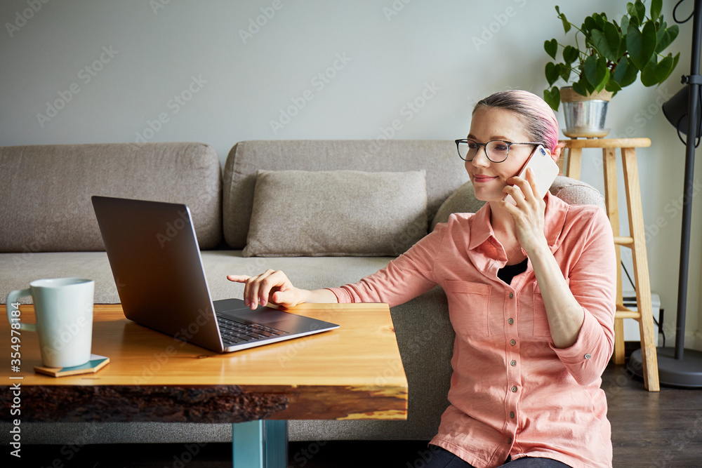 Young women working from home, with a smile on a phone call with her ...