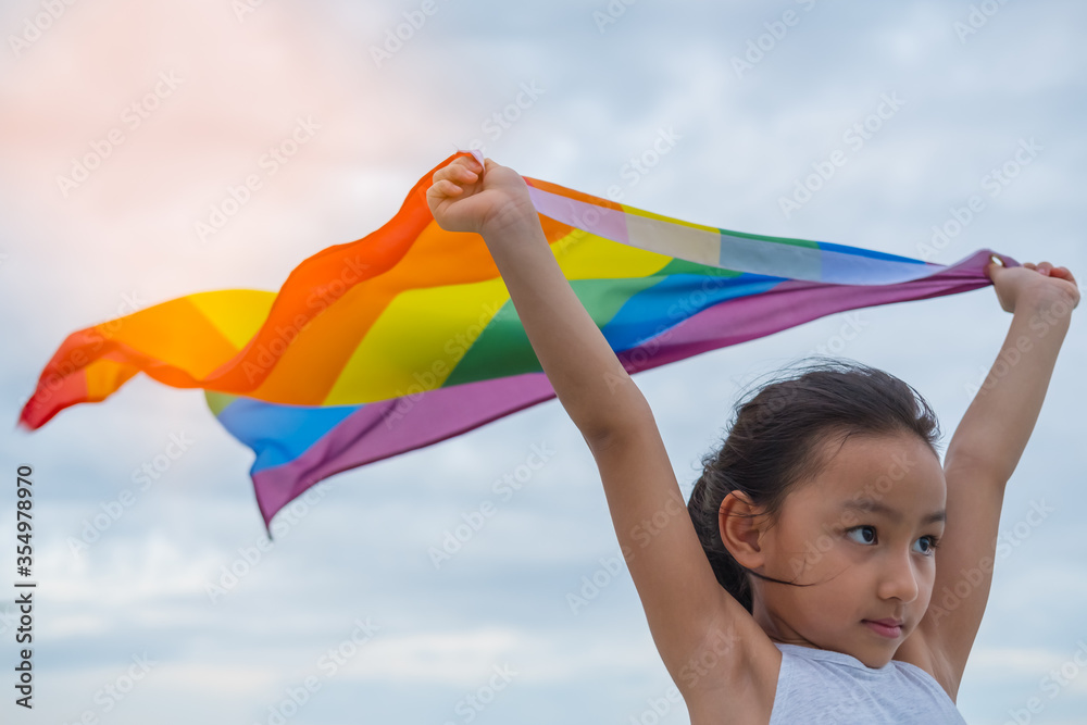 Rainbow flag symbol of love or LGBT pride concept.,Young girl show ...