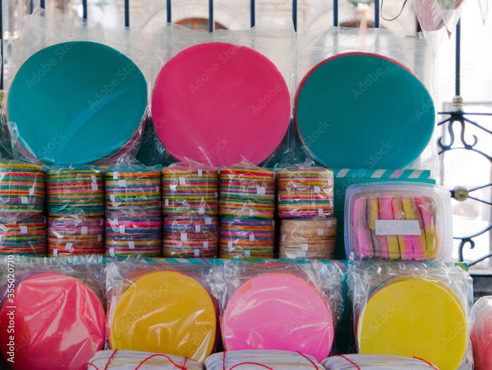Street stand full with Mexican traditional sweets, colorful wafers ...