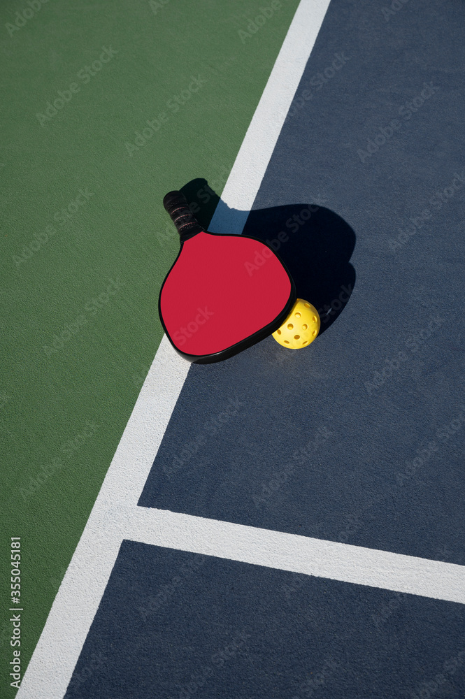 Pickleball Timeout - pickleball paddle and ball laying at center of ...