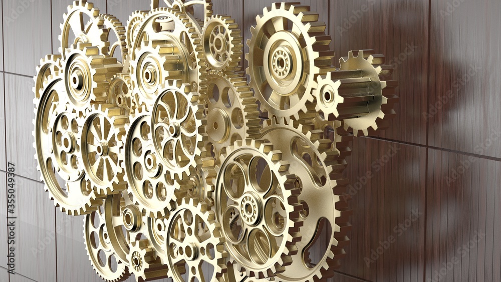 Mechanism gold gears and cogs at work on dark blown wood plate ...