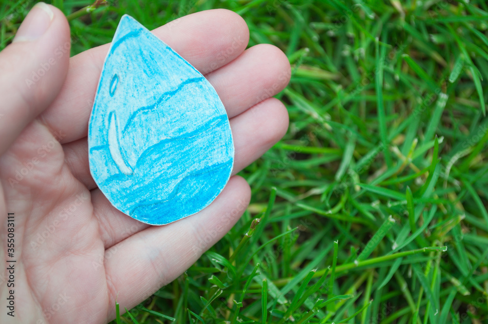 hand holds a drop of water, World Hand Hygiene Day. World Water Day ...