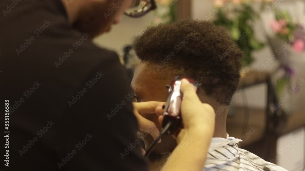Close up of Young attractive european professional barber making ...