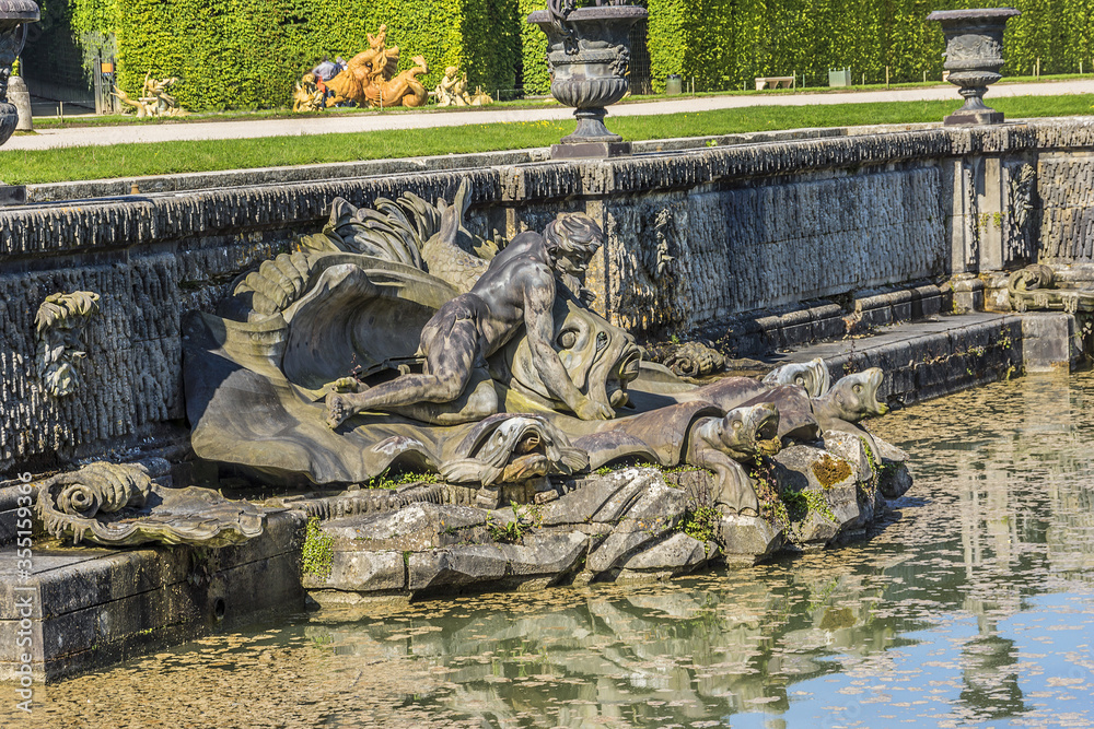 Neptune Fountain (1770) in gardens of famous Versailles palace. Palace ...