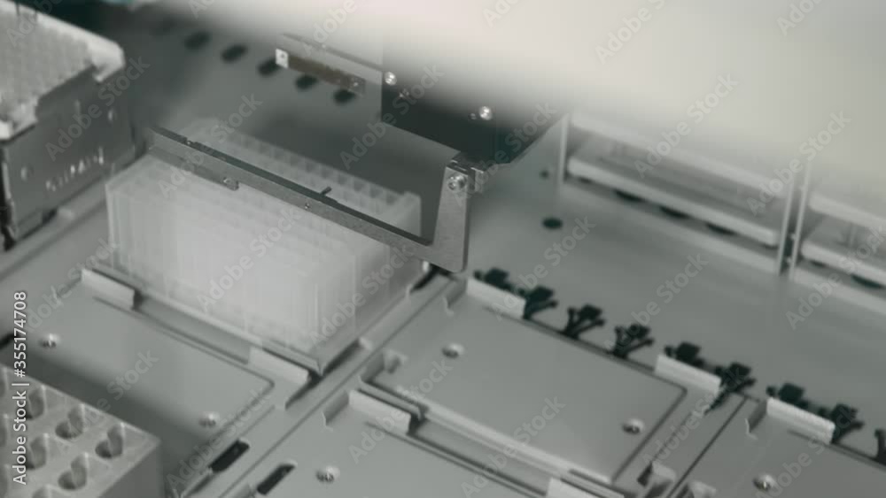 In a futuristic laboratory, a scientist analyzes a colored liquid to ...