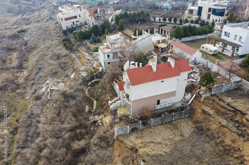 Landslide caused by rains of hurricane destroyed expensive cottages and ...